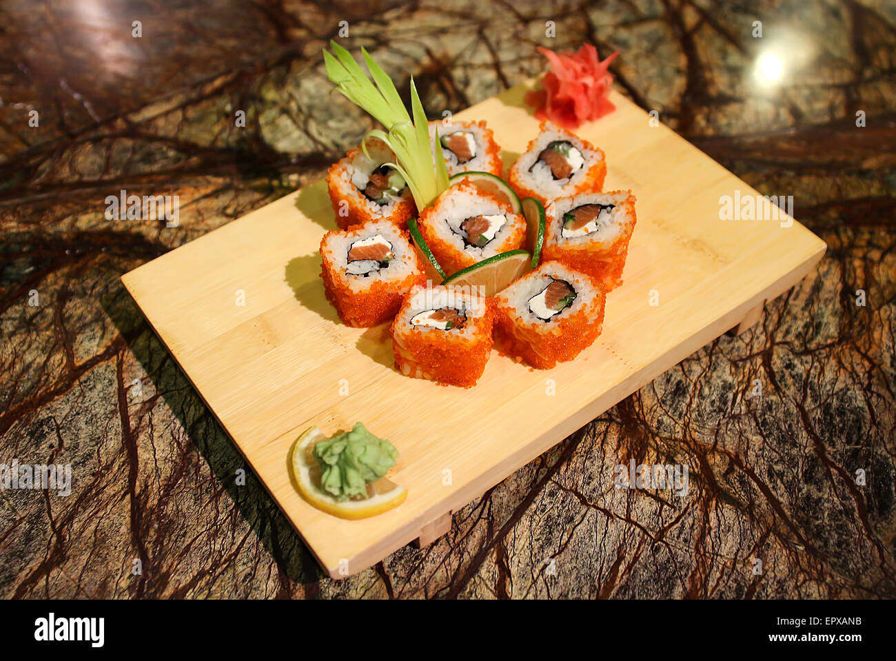 Delicious Philly maki sushi rolls served with a wood plate Stock Photo ...