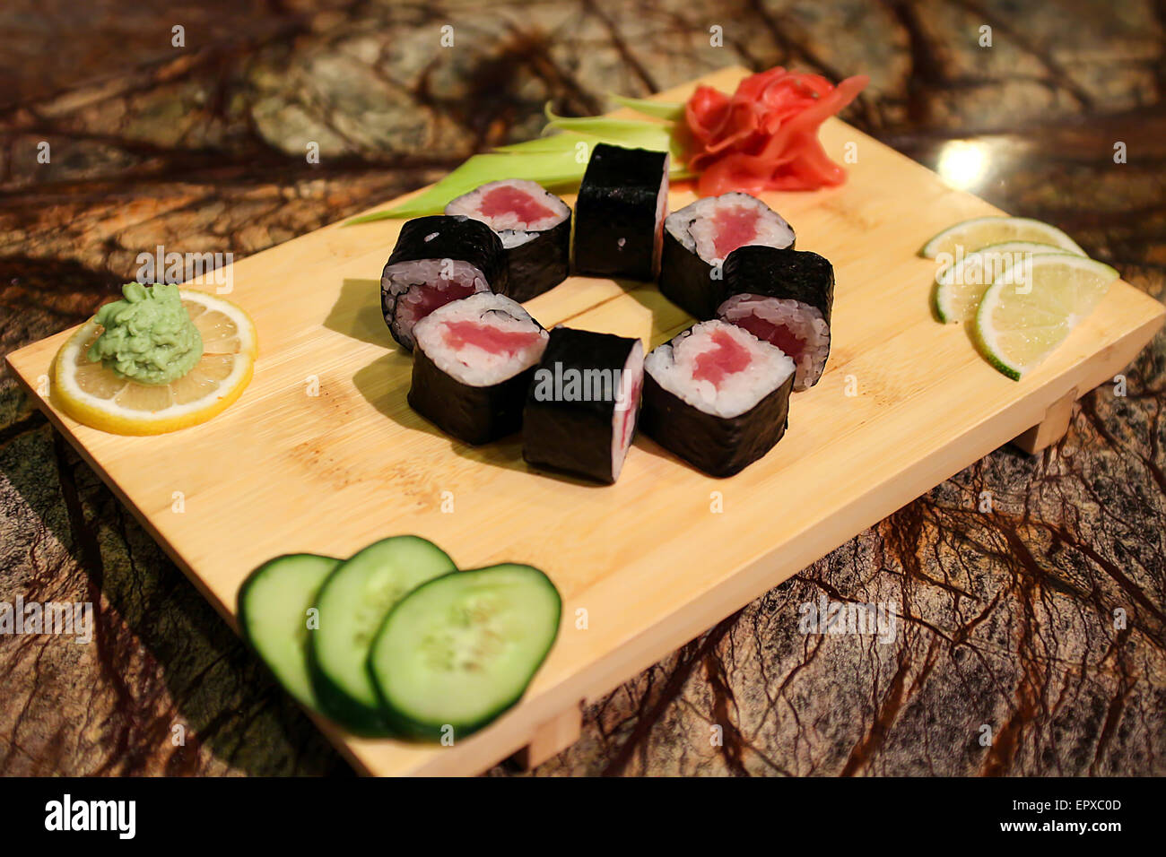Delicious Tekka maki sushi rolls served with a wood plate Stock Photo ...