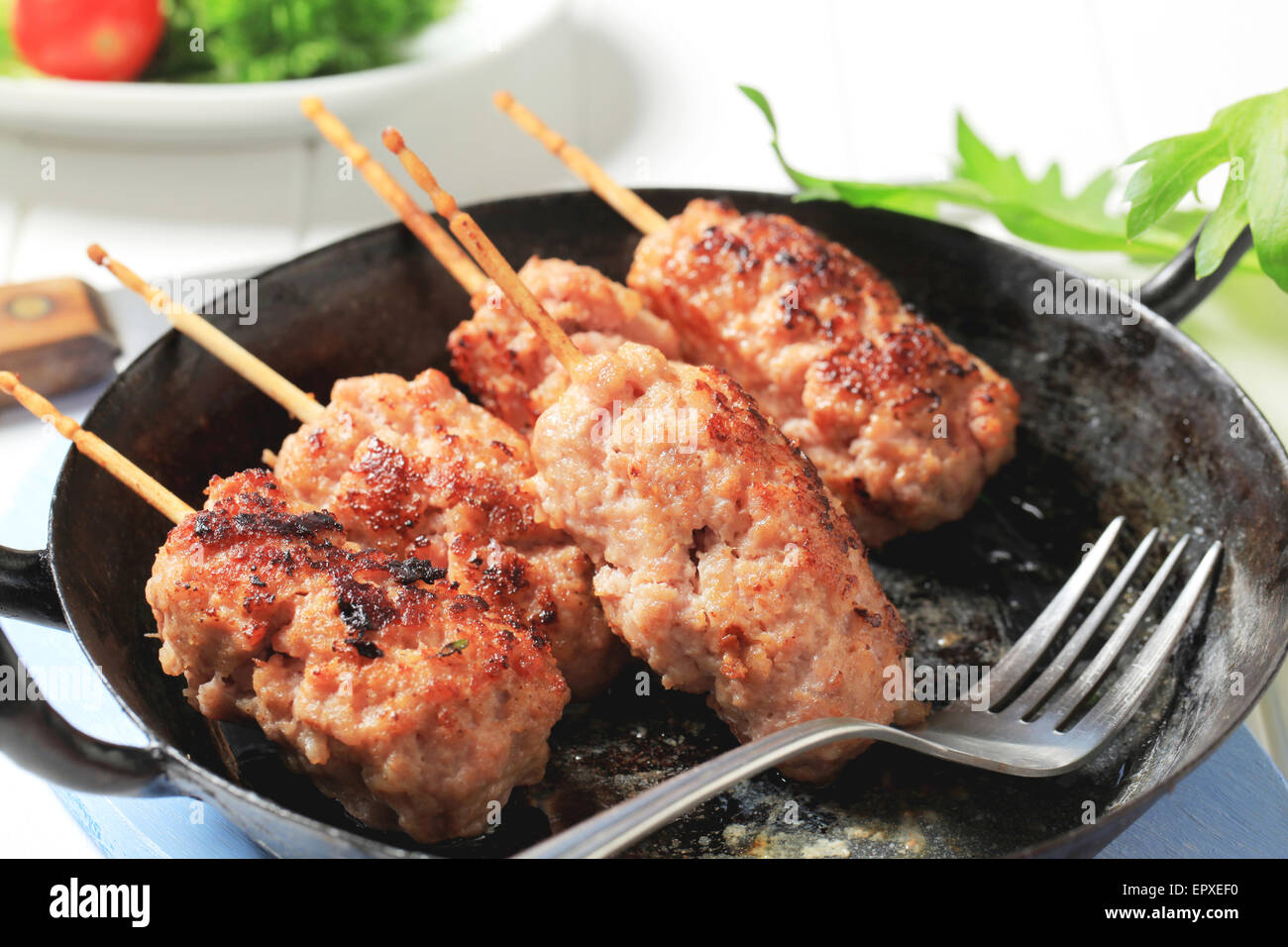 Minced meat kebabs on wooden sticks Stock Photo - Alamy