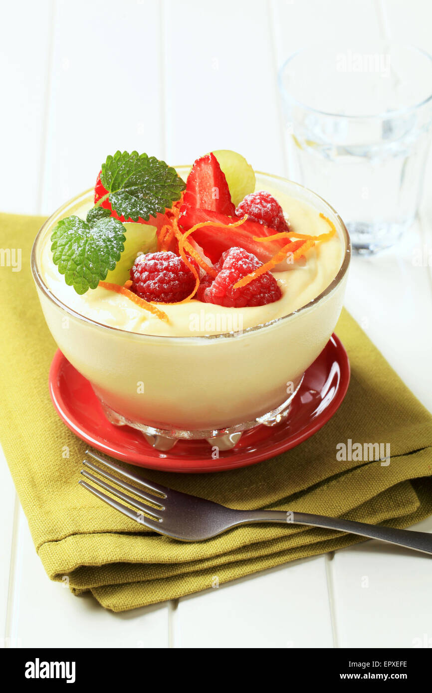 Bowl of creamy pudding topped with fresh fruit Stock Photo - Alamy