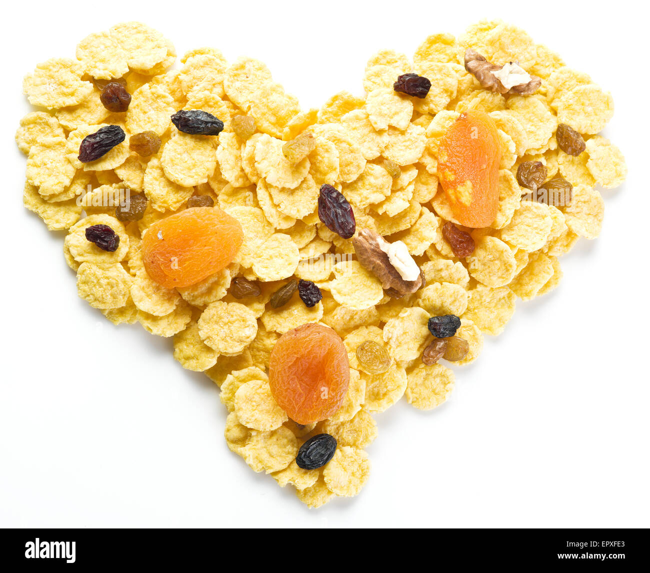 Cornflakes arranged in the shape of heart. Isolated on a white Stock ...