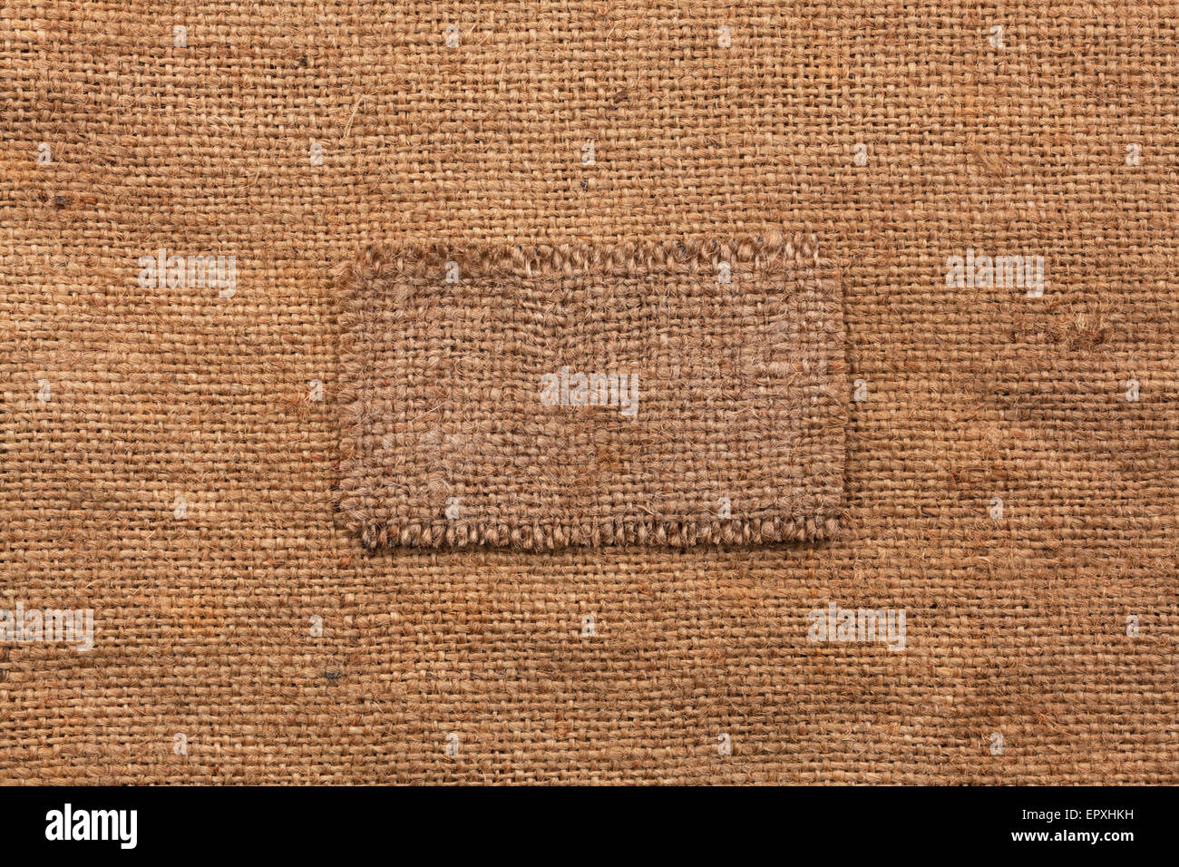 Frame made of burlap lies on a sacking background,can be used as ...