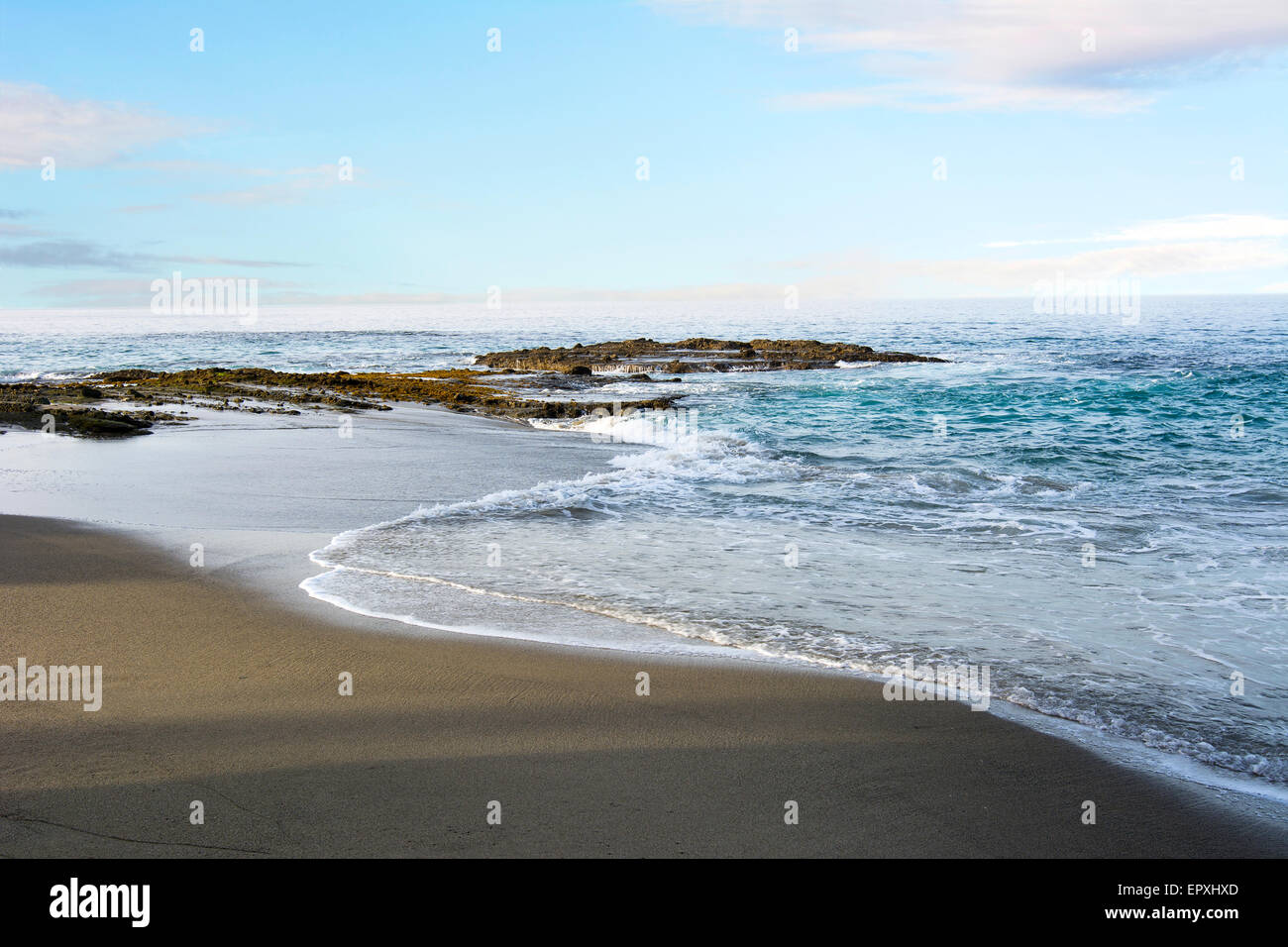 A beautiful pastel morning along a beach in Laguna California with ...