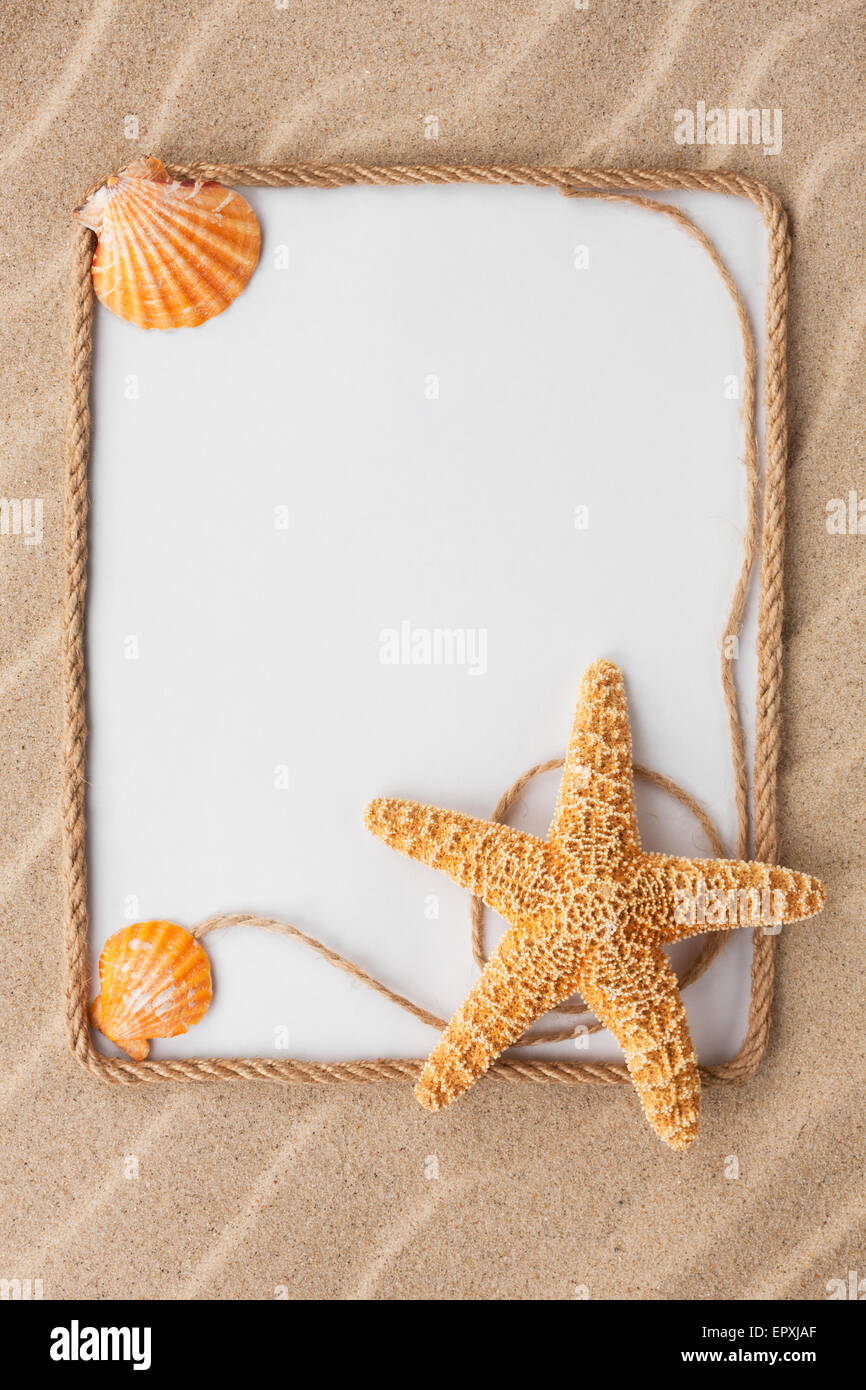 Beautiful frame of rope and star and sea shells with a white background ...