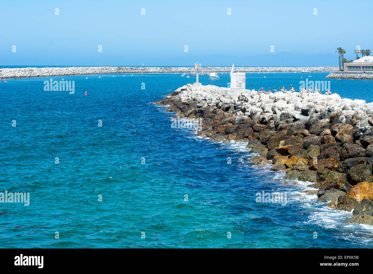 A view of King Harbor breakwater during a bright, sunny day reveals the ...