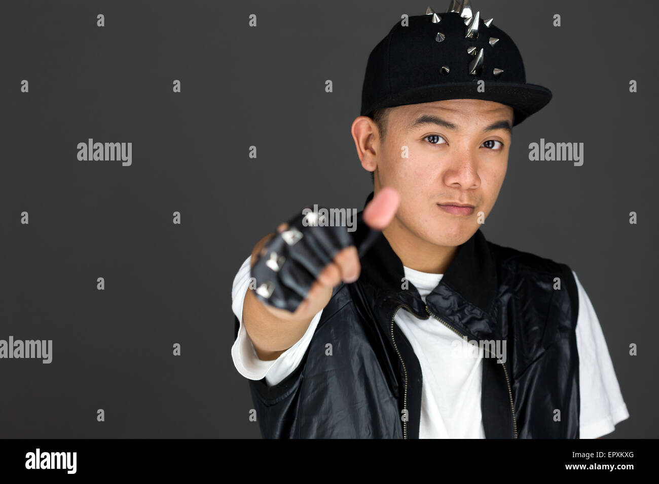 Model in studio isolated on plain grey background Stock Photo - Alamy