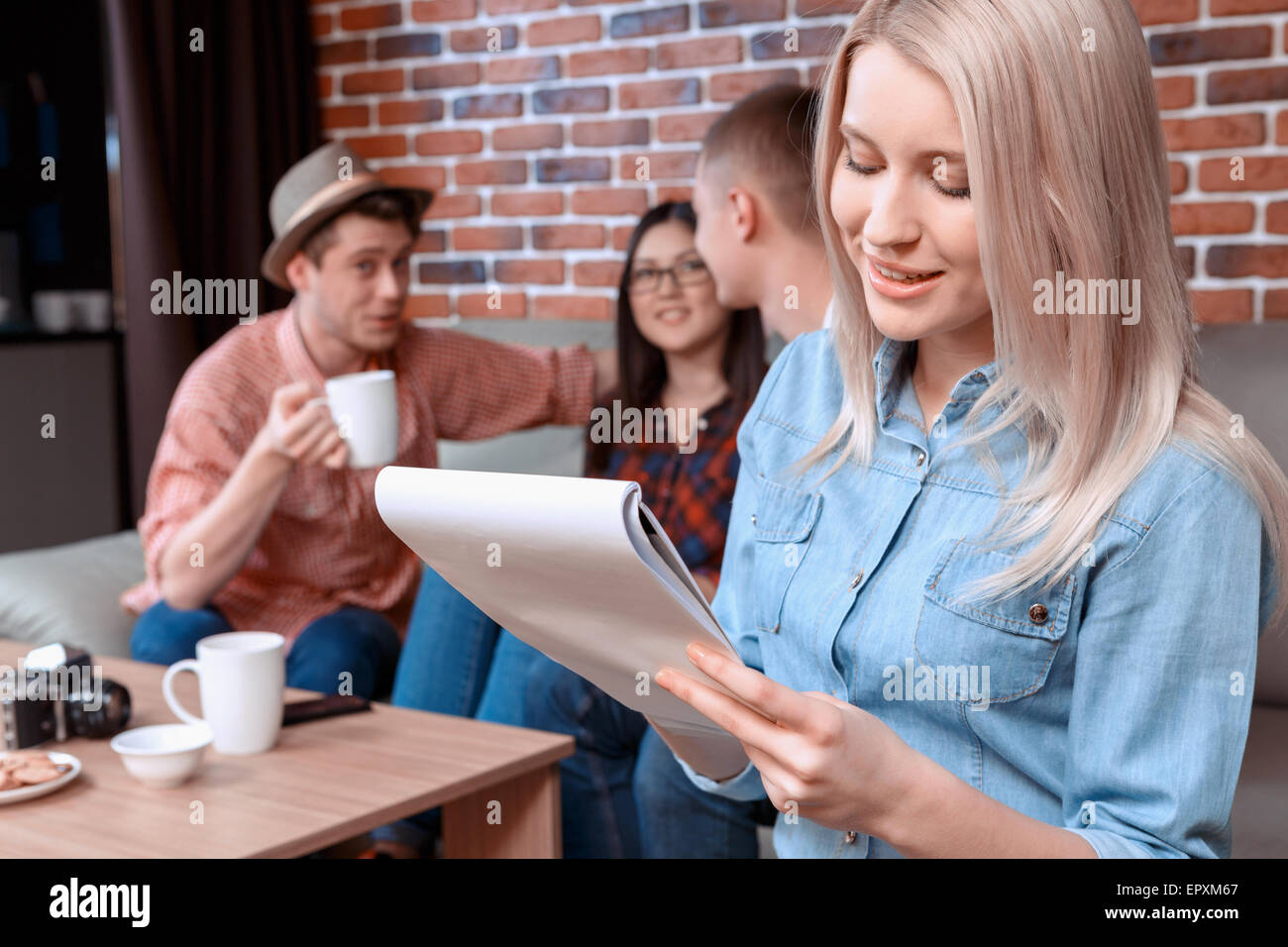 Girl writing her notebook in cafe Stock Photo - Alamy