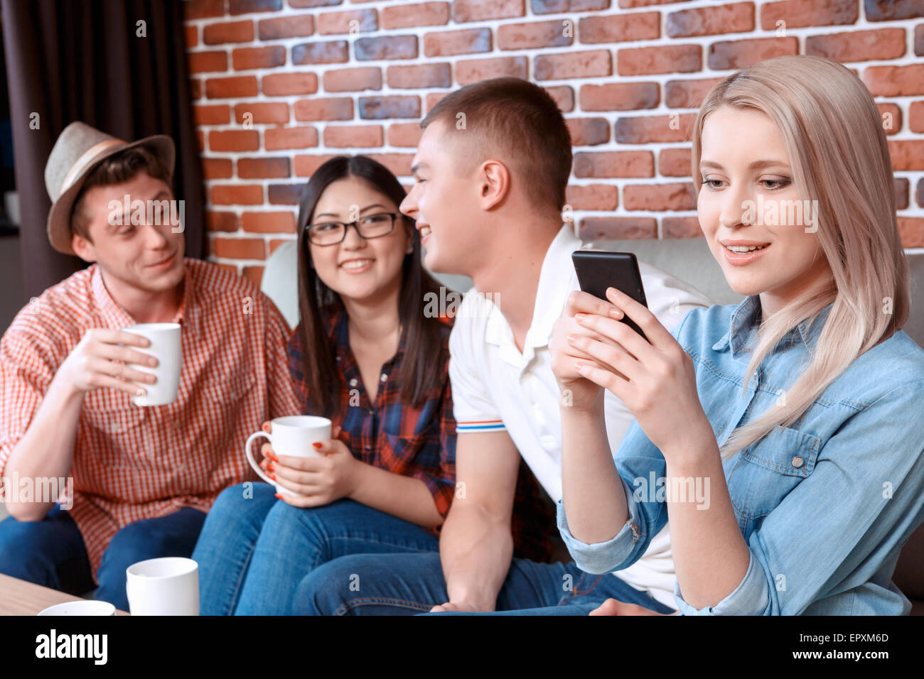 Young people waiting for the order in a cafe Stock Photo - Alamy