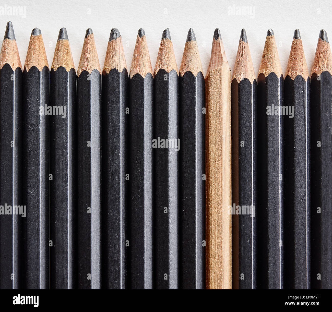 Pencils, one different inside the group Stock Photo - Alamy