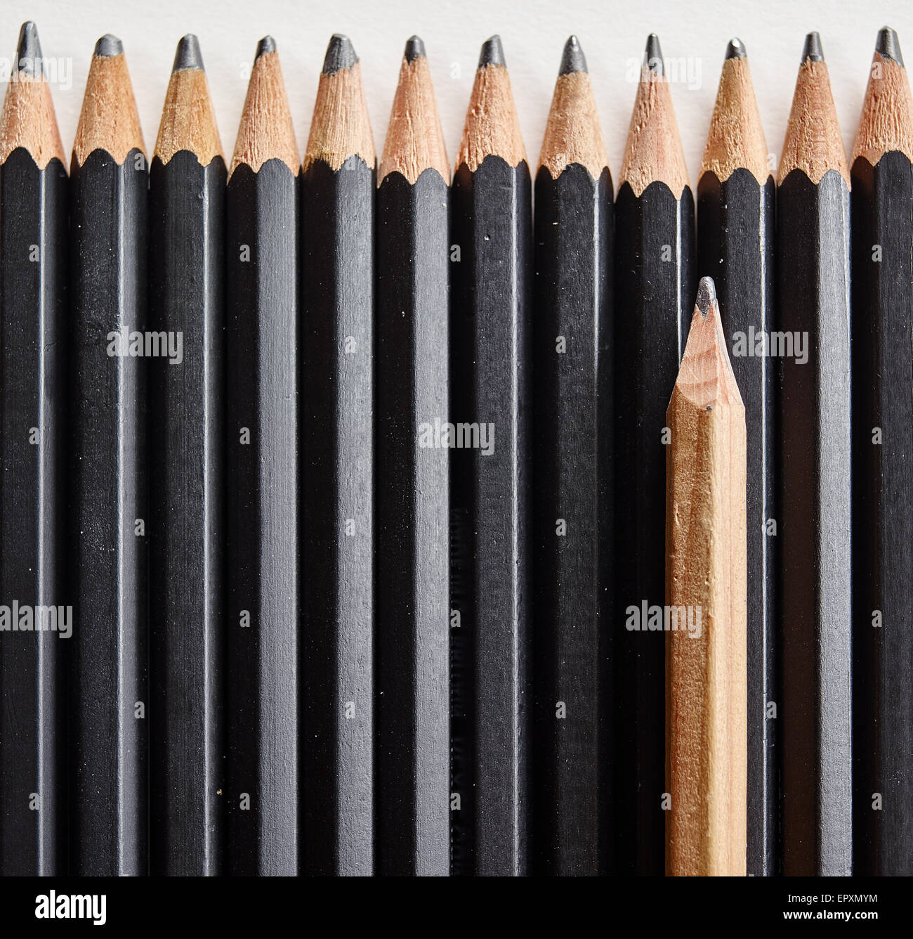 Pencils, one different inside the group Stock Photo - Alamy