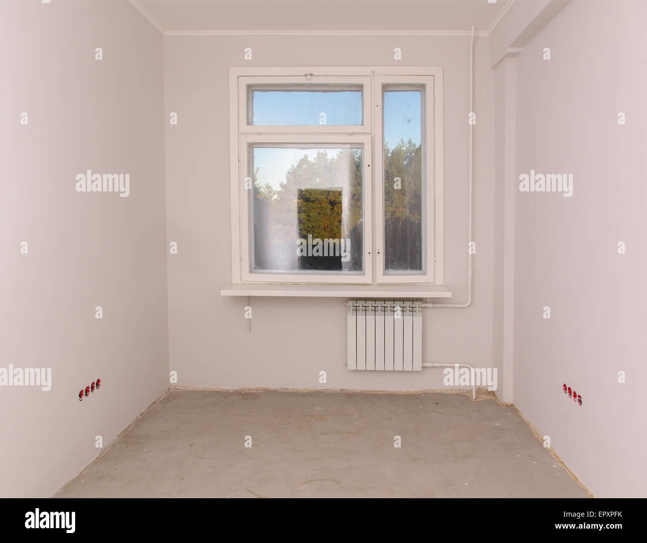 the room in which repair with a window and a radiator is recently made ...