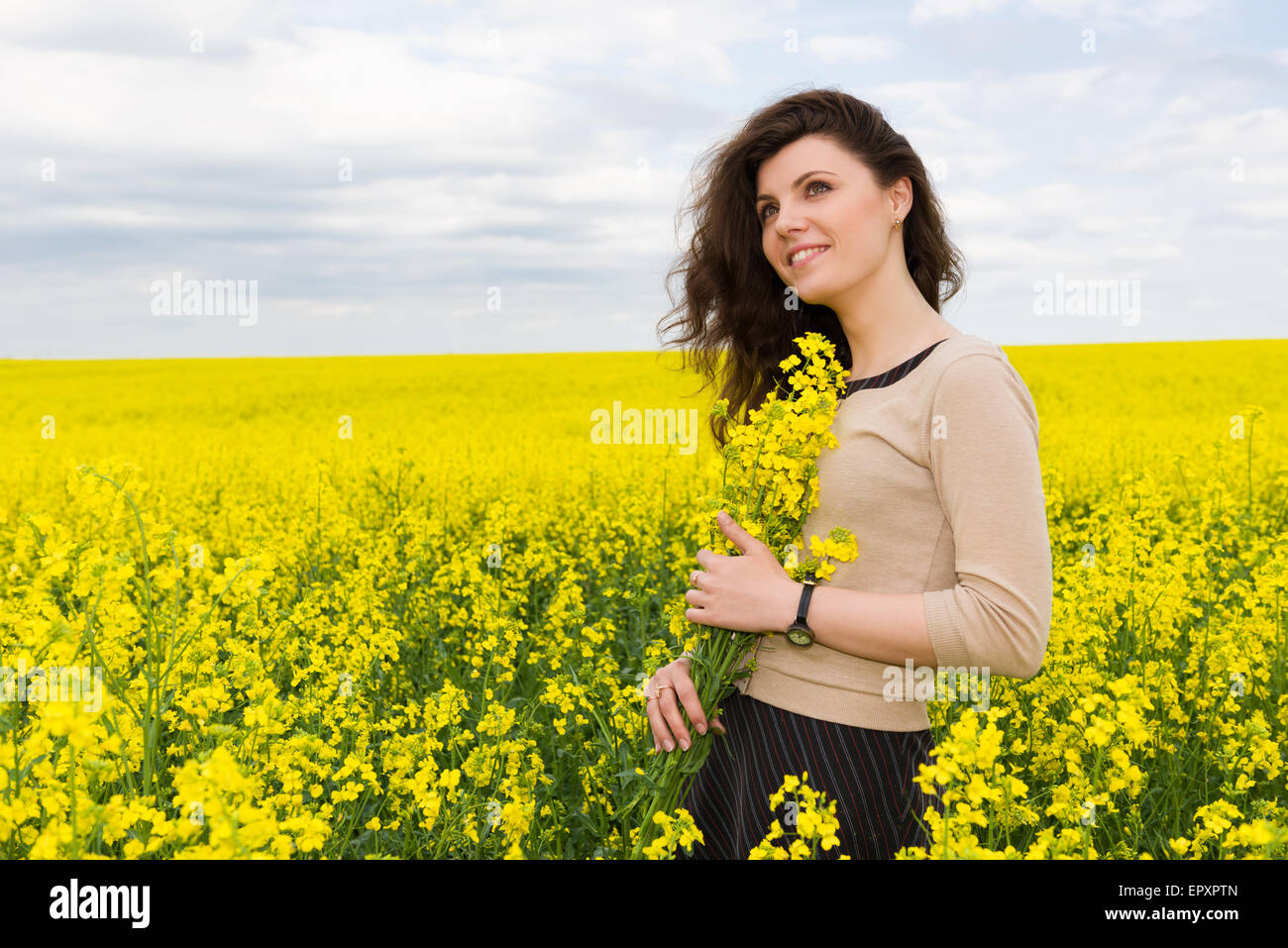 girl portrait in yellow flower field Stock Photo - Alamy