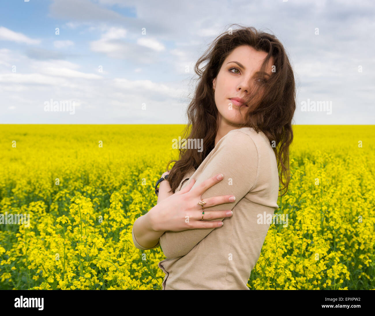 girl portrait in yellow flower field Stock Photo - Alamy