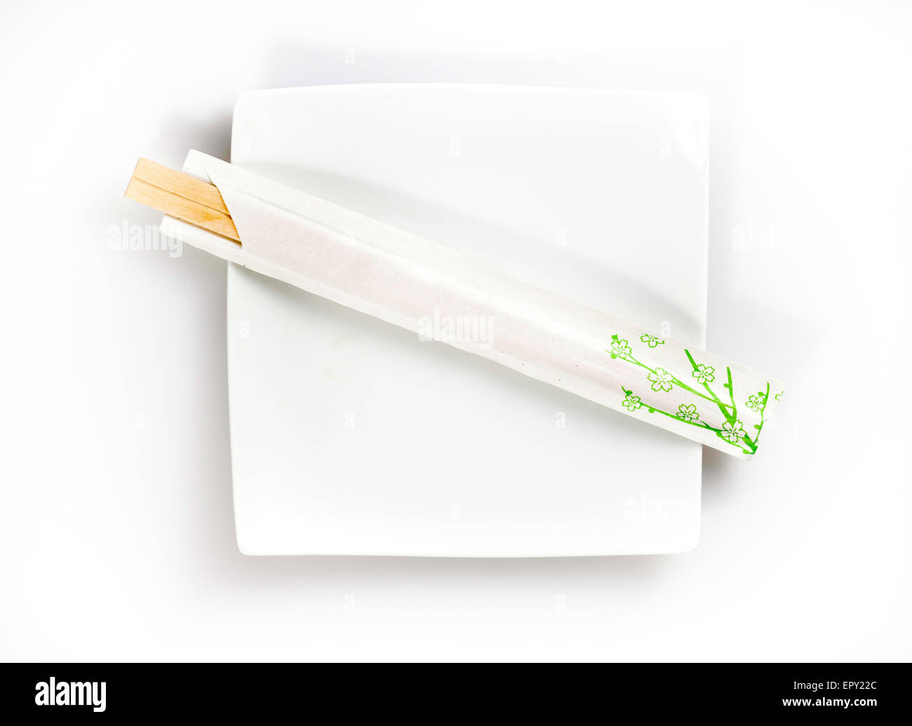 disposable chopsticks on a plate isolated on a white background Stock ...