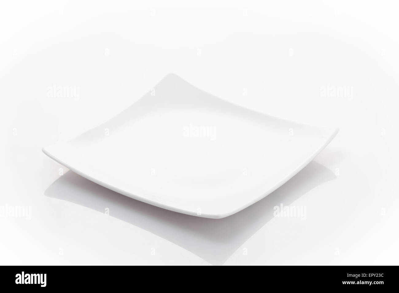 one empty square plate isolated on a white background Stock Photo - Alamy