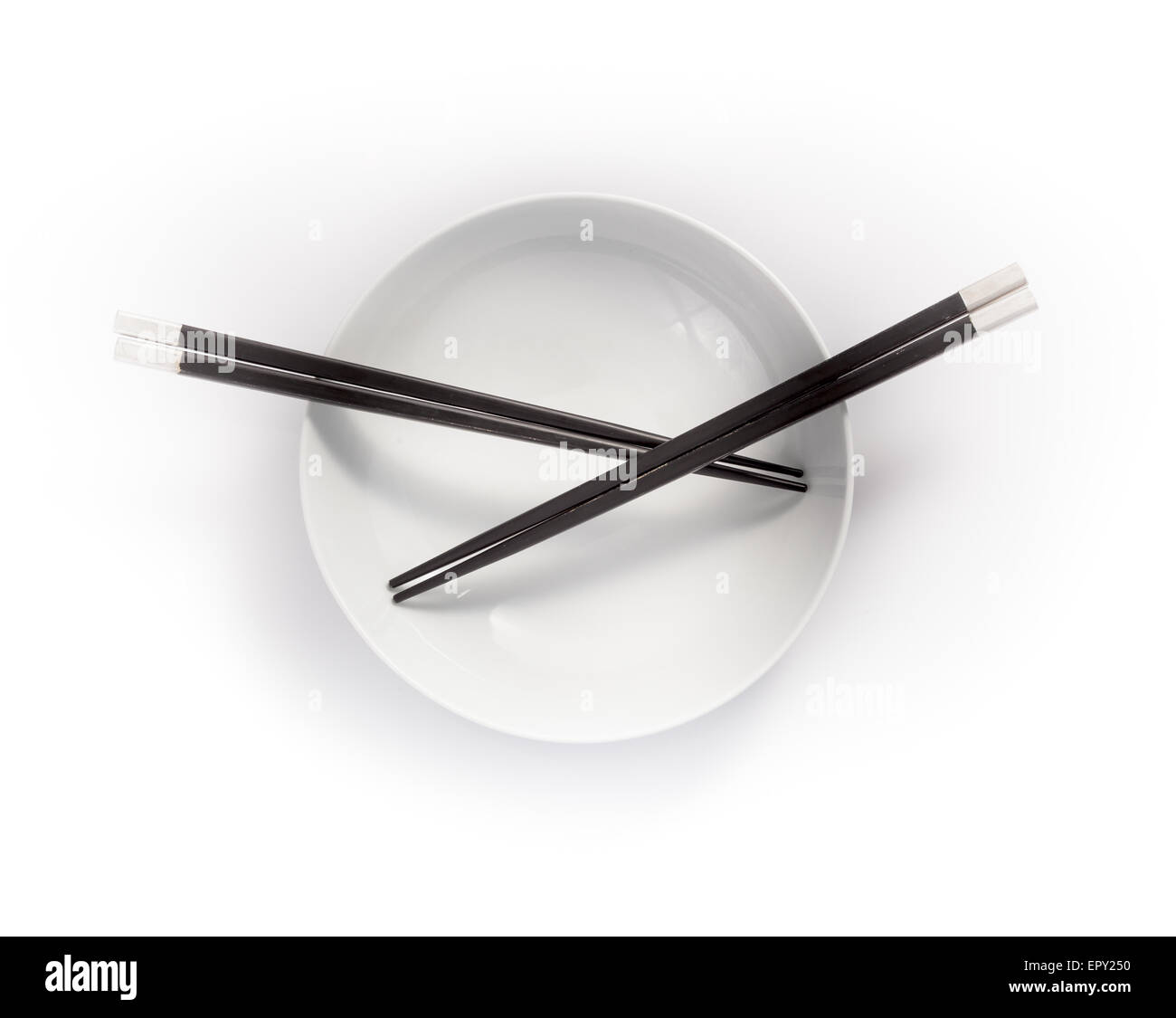Chopsticks on bowl in Cut Out Stock Images & Pictures - Alamy
