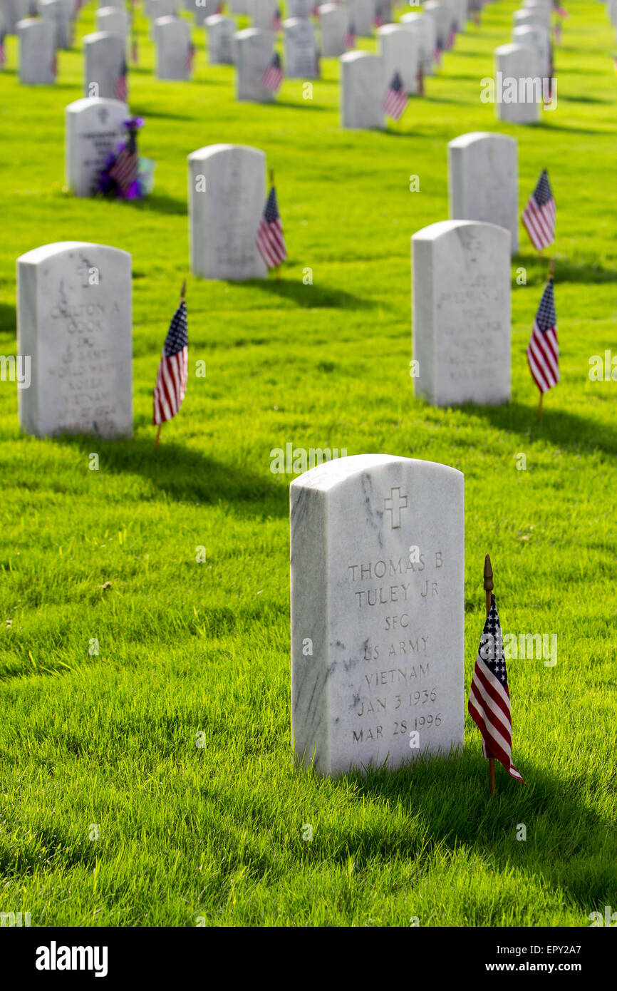 American flags freshly placed at gravesites by volunteers in ...