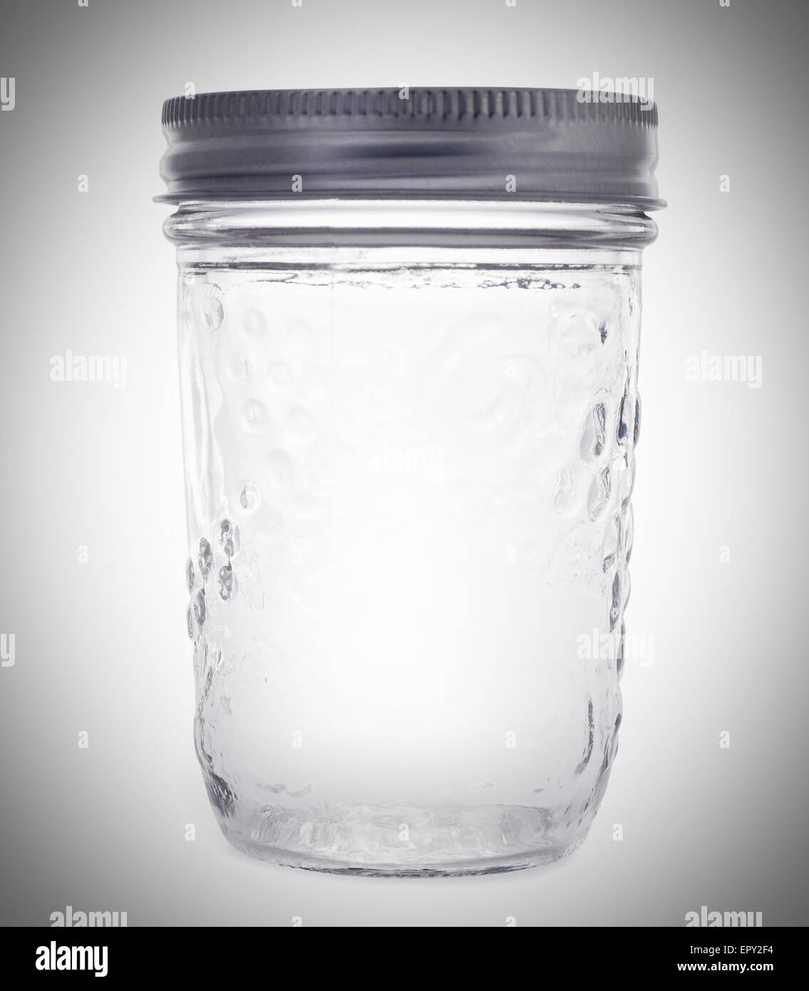 empty glass jarr isolated on a white background Stock Photo - Alamy