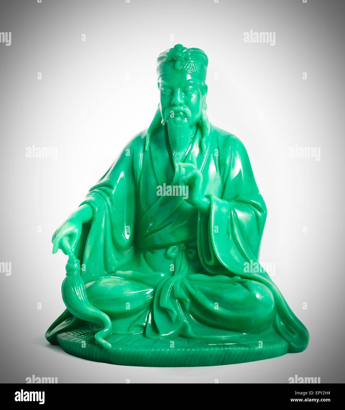 green jade buddha isolated on a white background Stock Photo - Alamy