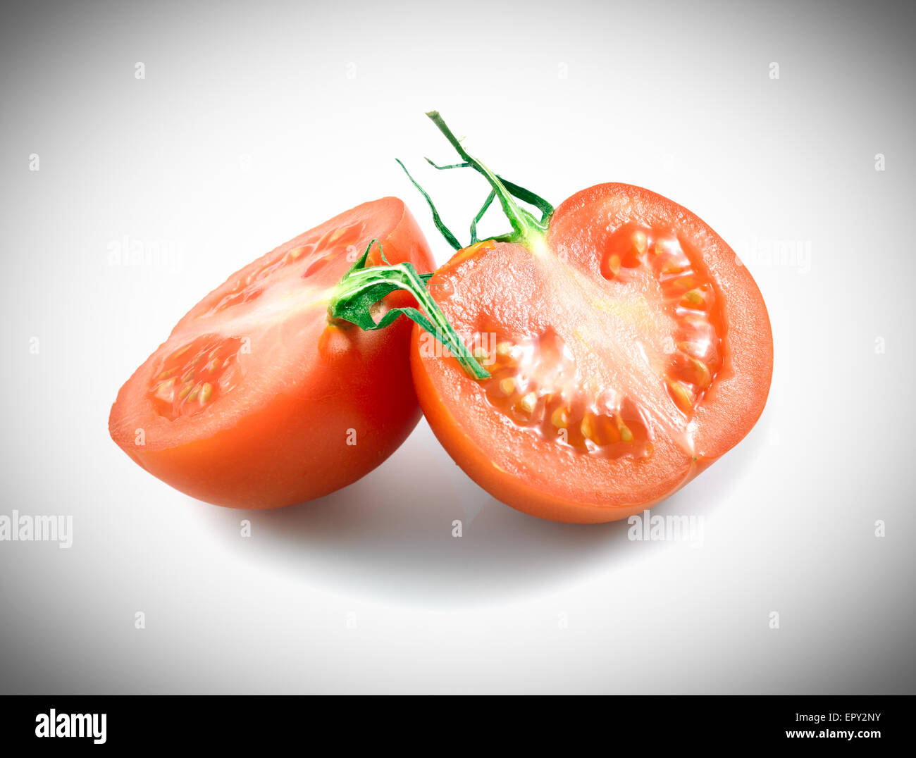 half tomato isolated on a white background Stock Photo - Alamy