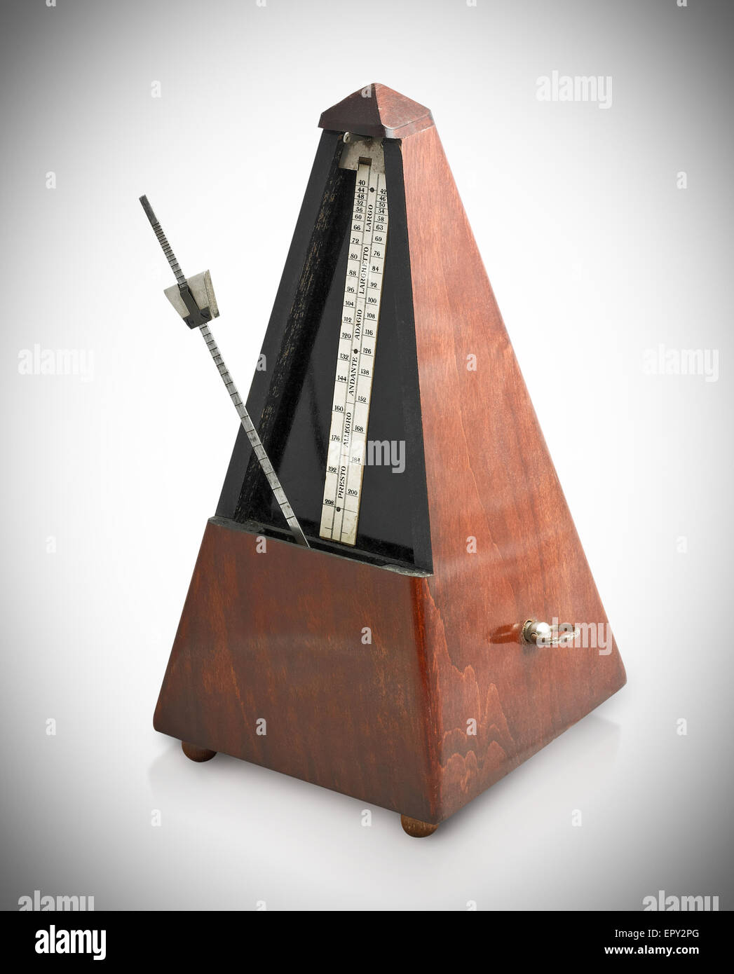 metronome isolated on a white background Stock Photo - Alamy