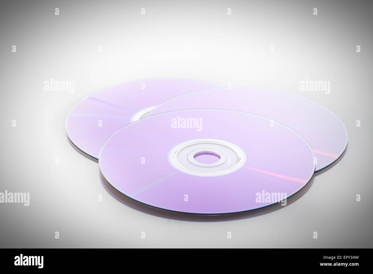 three dvds isolated on a white background Stock Photo - Alamy