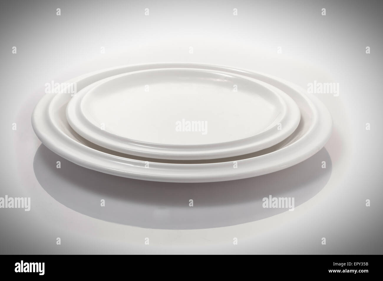 two china plates isolated on a white background Stock Photo - Alamy