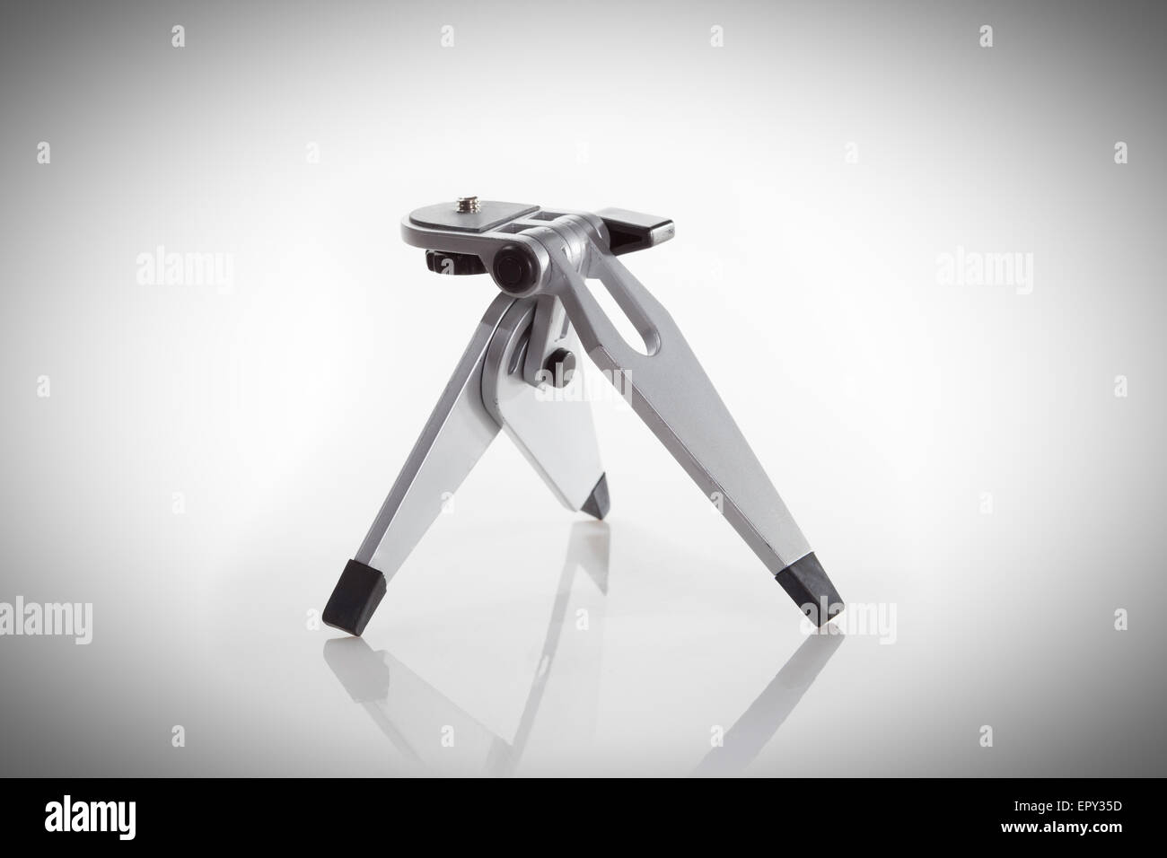 mini camera tripod isolated on a white background Stock Photo - Alamy
