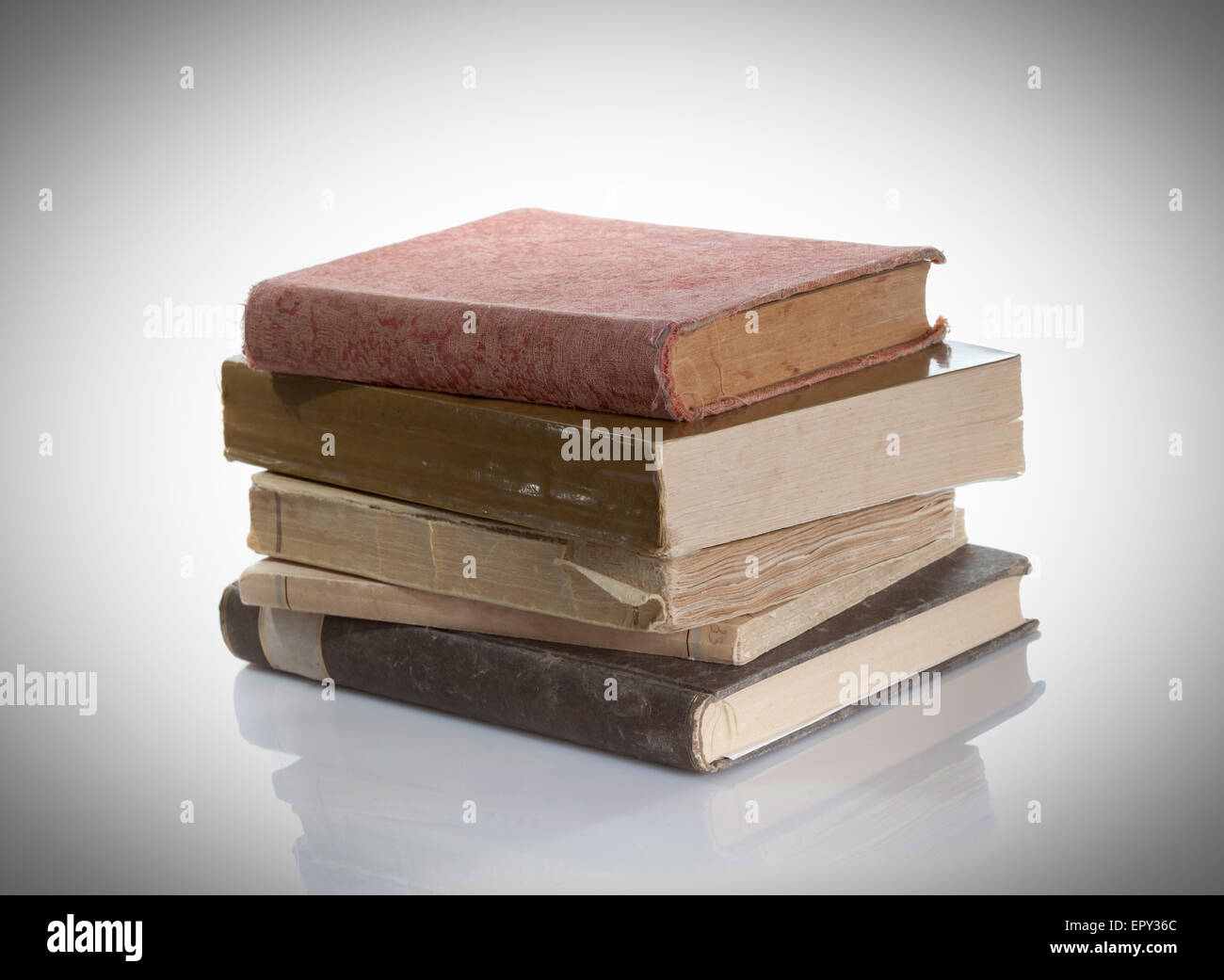 stack of old books isolated on a white background Stock Photo - Alamy