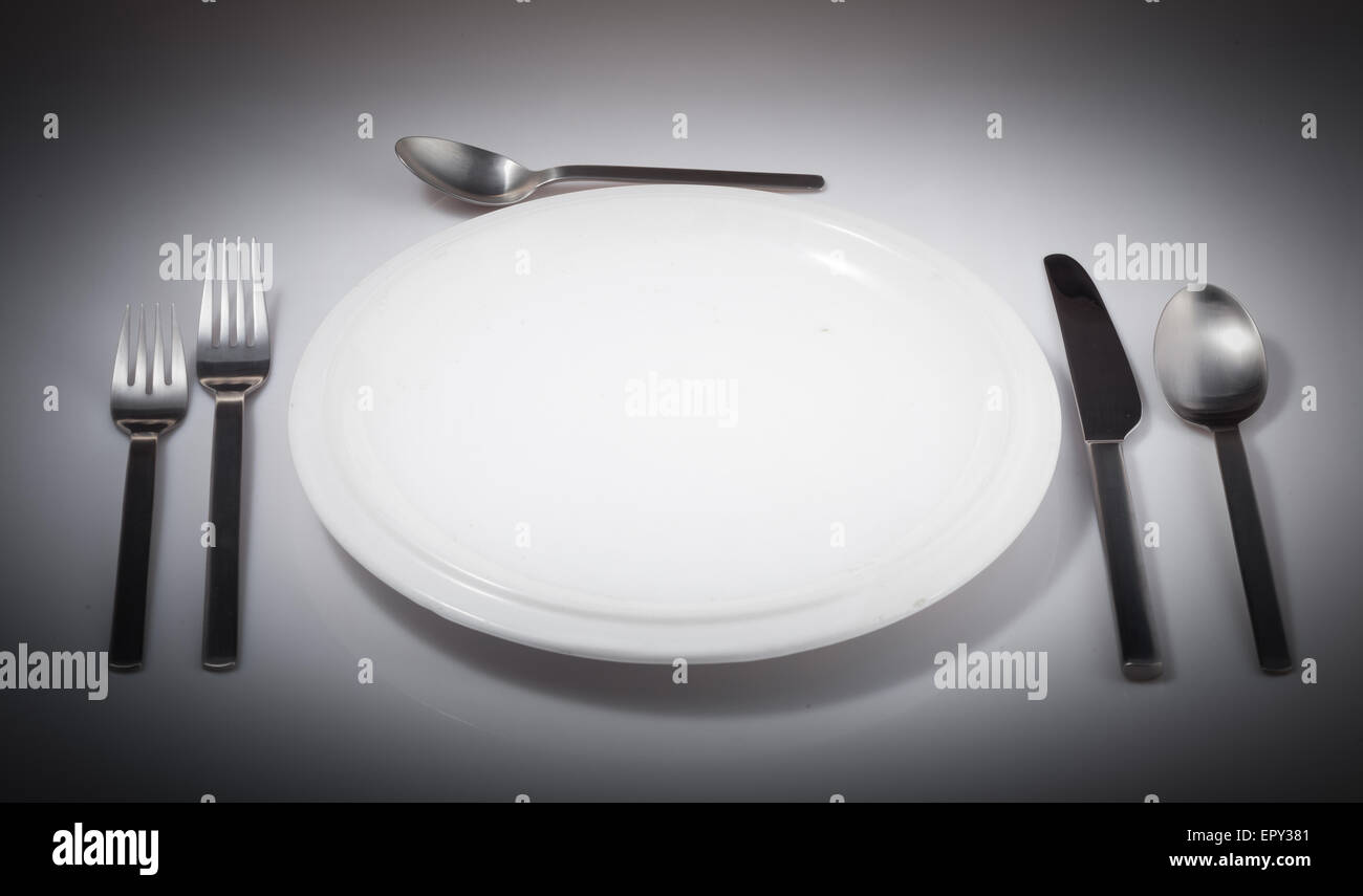 empty silver spoon isolated on a white background Stock Photo - Alamy