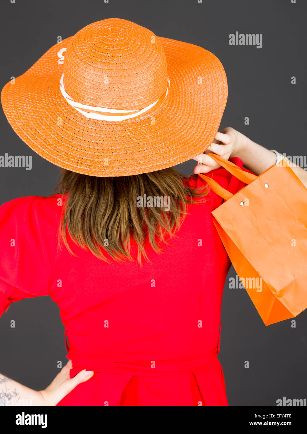 Model in studio isolated on plain grey background Stock Photo - Alamy