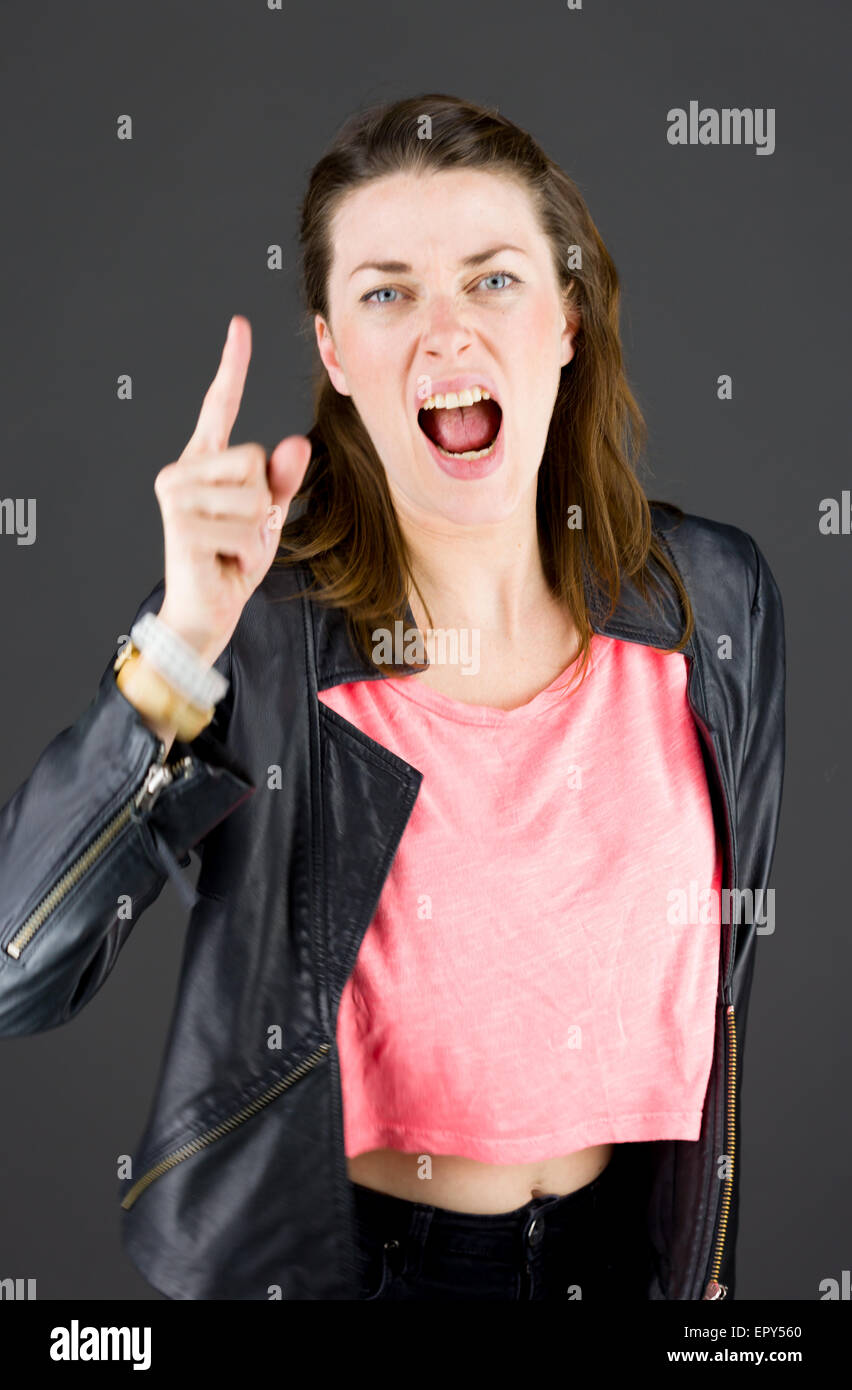 Model in studio isolated on plain grey background Stock Photo - Alamy