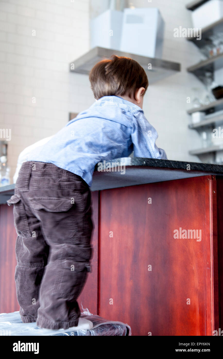 Boy Leaning On Stool High Resolution Stock Photography and Images - Alamy