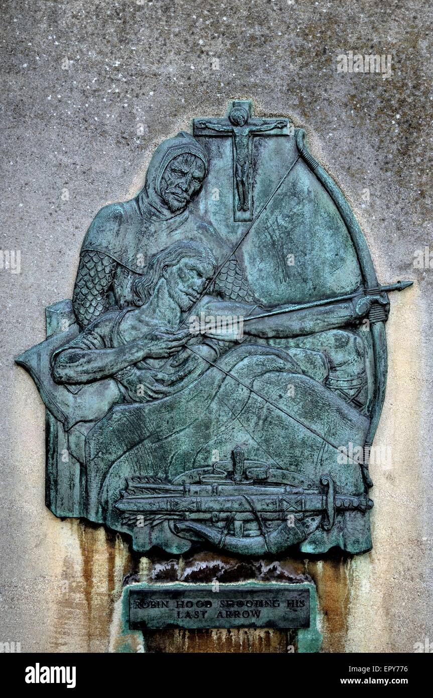 Plaque on the castle wall showing Robin Hood shooting his last arrow ...