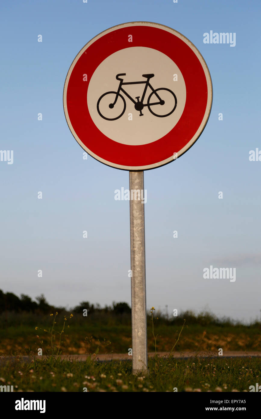 A No Cycling Sign against a blue sky Stock Photo - Alamy