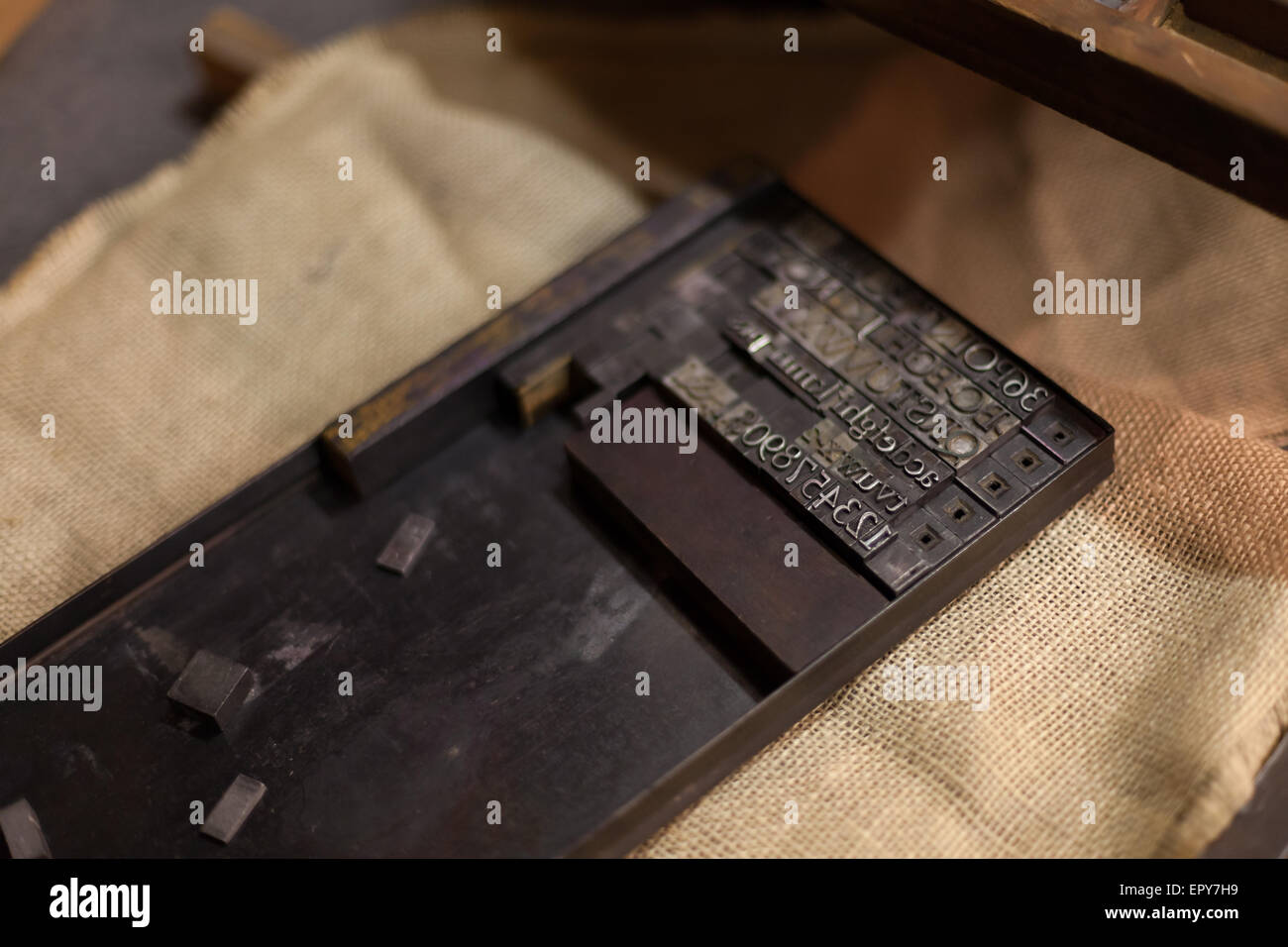 Close-up of metal letterpress letters in printing machinecolor image ...