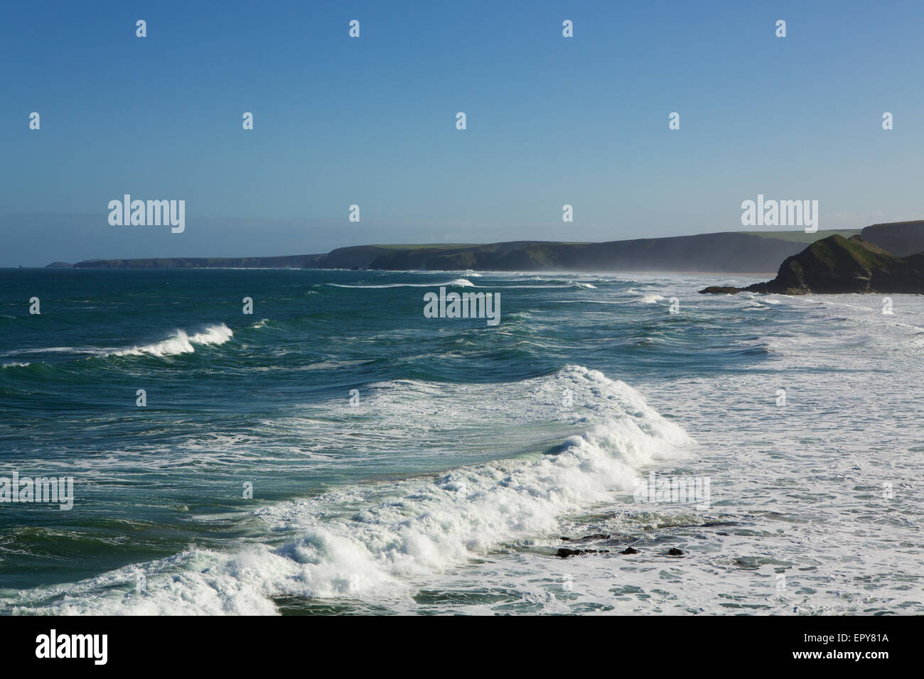 Surfs up in Newquay the UK's surfing Capital. View looking along the ...