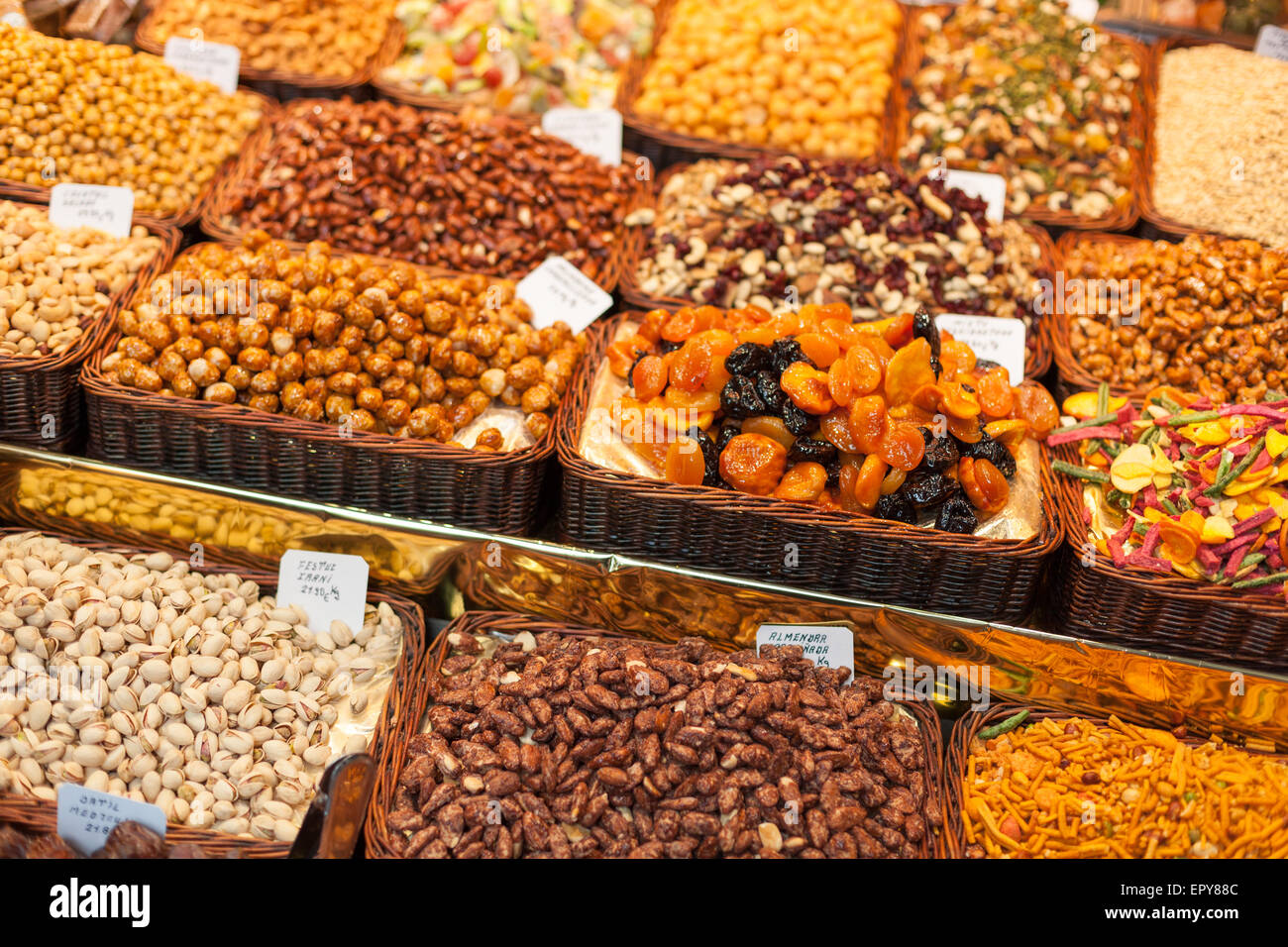 Display of dry fruits for sale at a market, La Boqueria Market ...