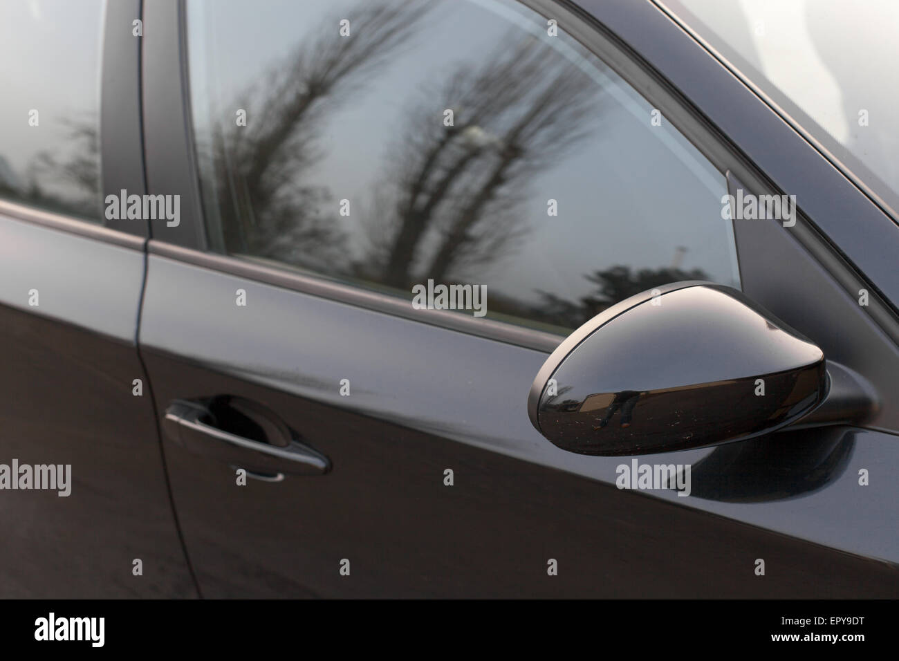 Reflection of trees in the window of a car Stock Photo - Alamy