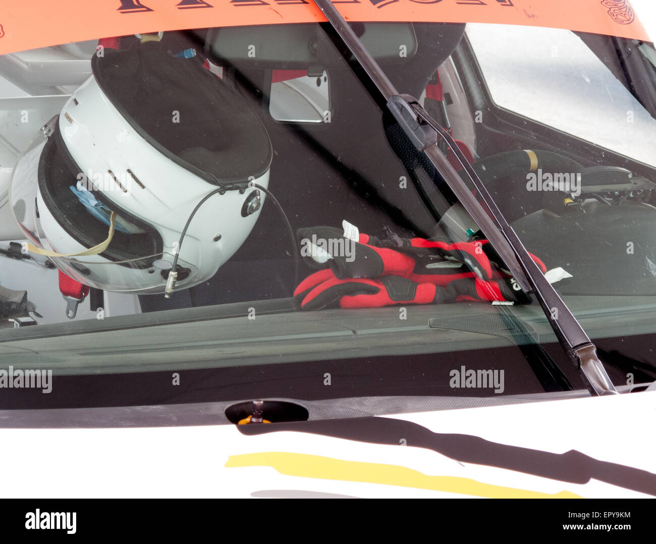 Sports helmet in a racing car Stock Photo - Alamy