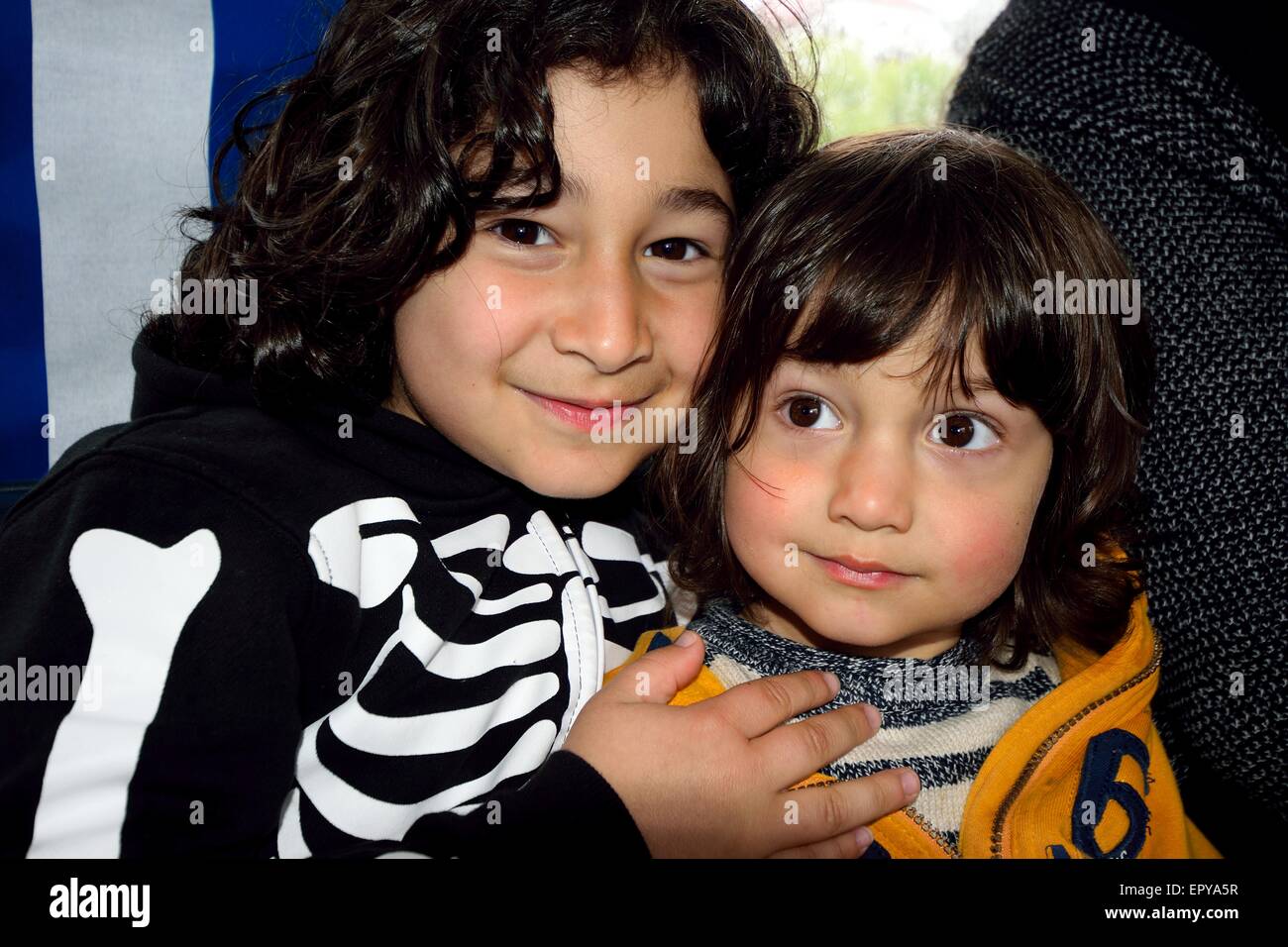 Two brothers side by side Stock Photo - Alamy