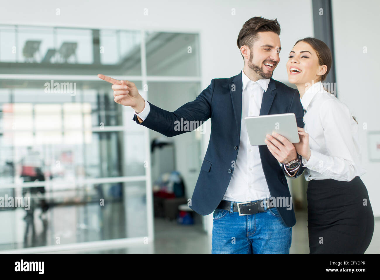 Young people with tablet in the office Stock Photo - Alamy