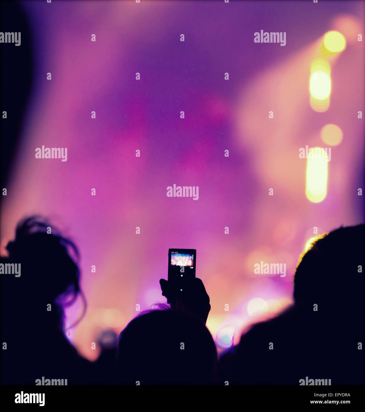 Cheering crowd in front of bright colorful stage lights - retro styled ...