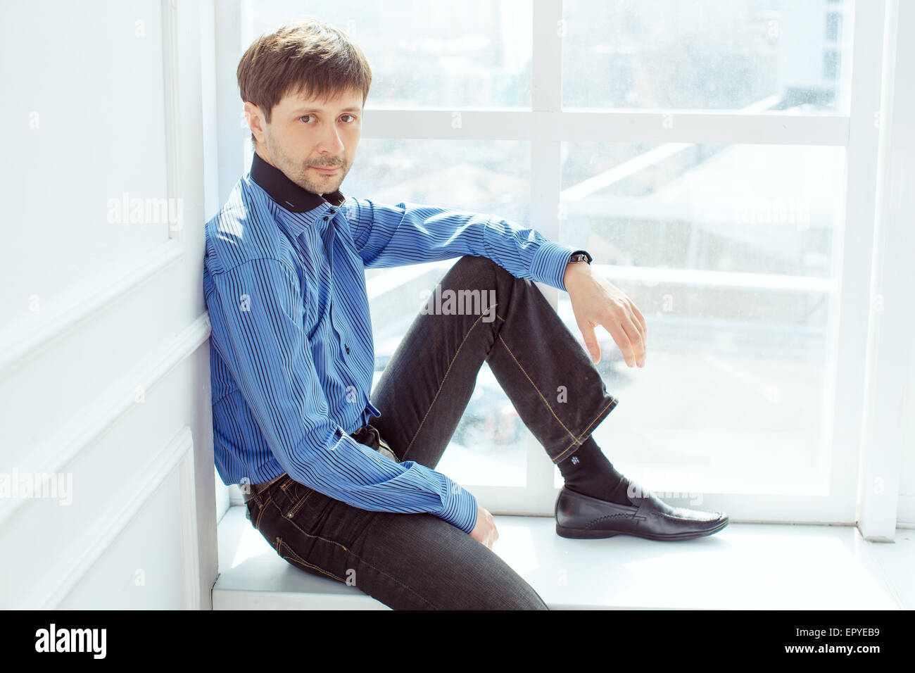 Men portrait at window Stock Photo - Alamy