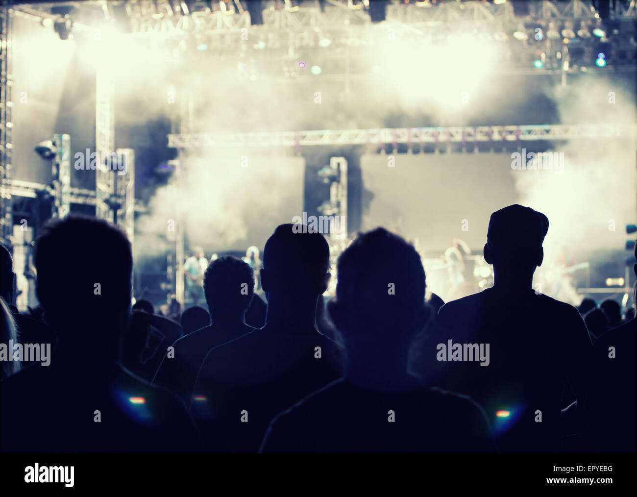 Cheering crowd in front of bright colorful stage lights - retro styled ...