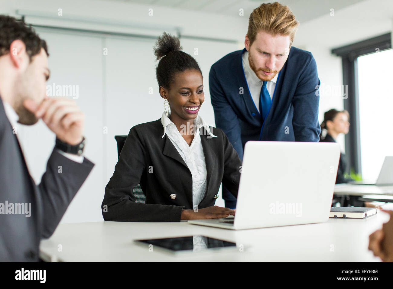 Young people working in the office Stock Photo - Alamy