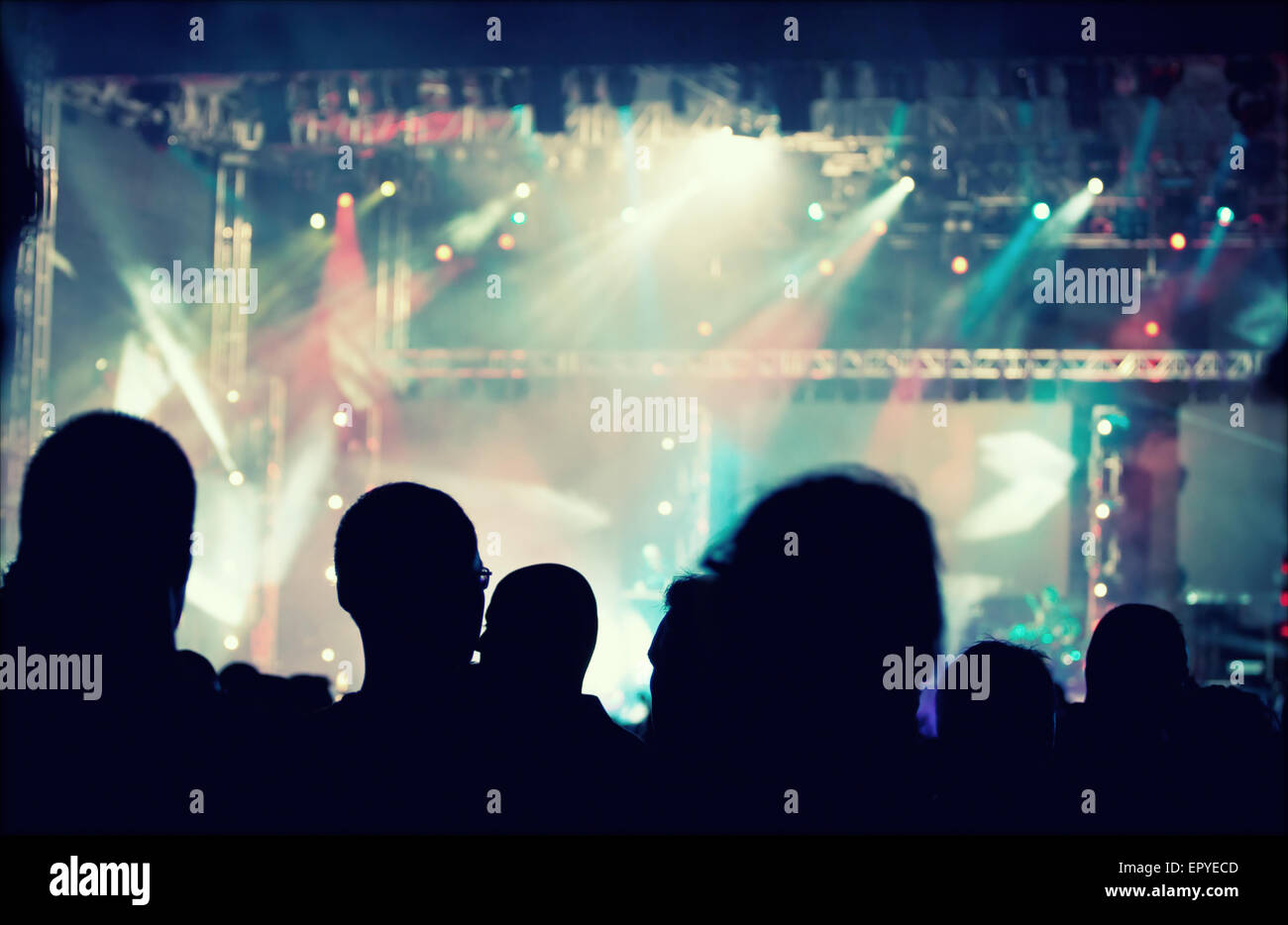Cheering crowd in front of bright colorful stage lights - retro styled ...