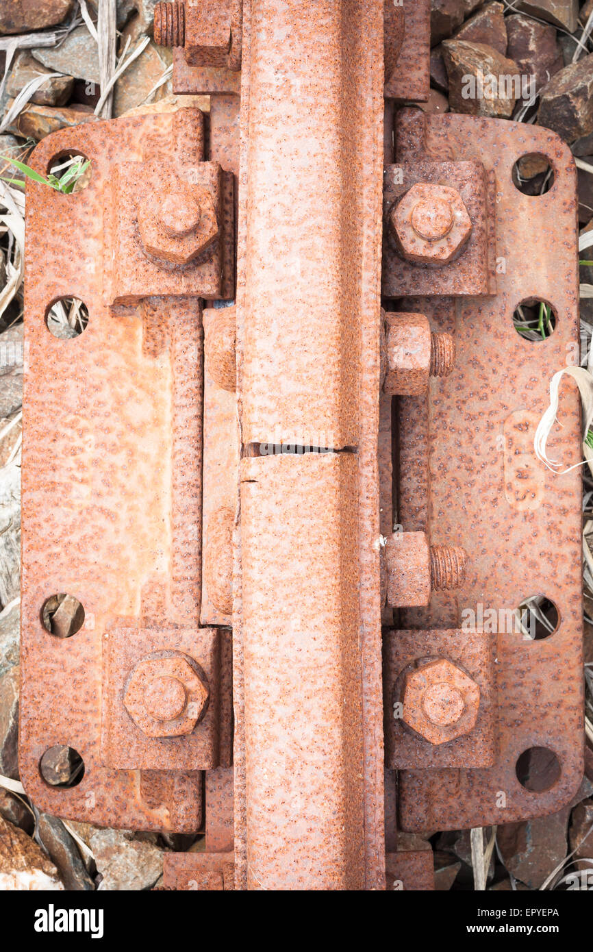 Bolts rusted tracks. Particular of a rail tie with track and rusted ...