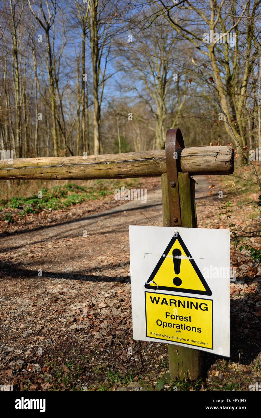 Warning sign in forest Stock Photo - Alamy