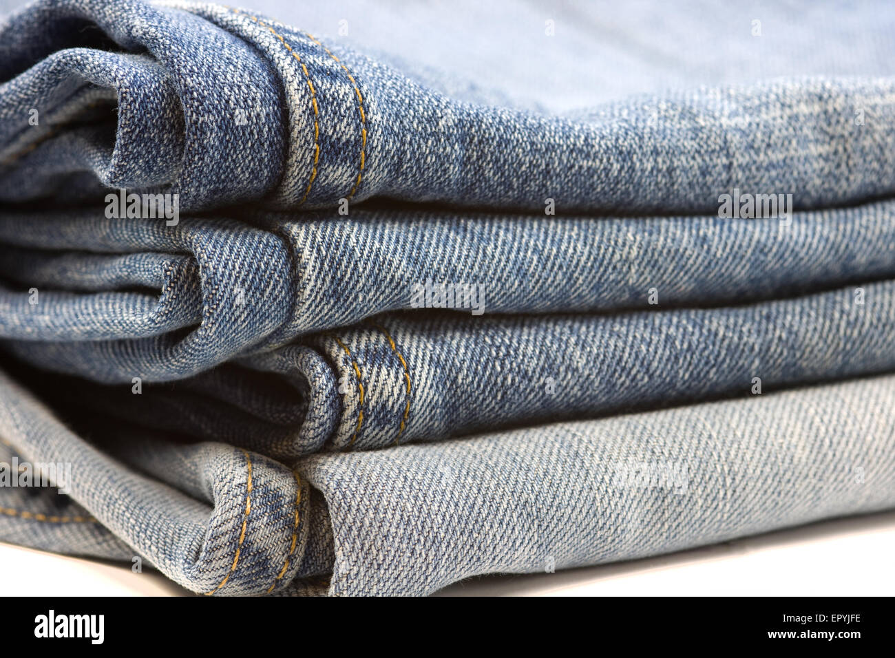 A stack of blue Denim jeans close-up Stock Photo - Alamy